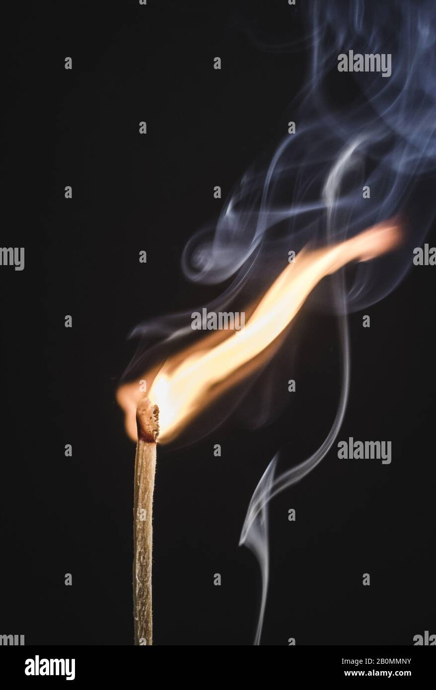 A matchstick burning on black background with smoke Stock Photo - Alamy
