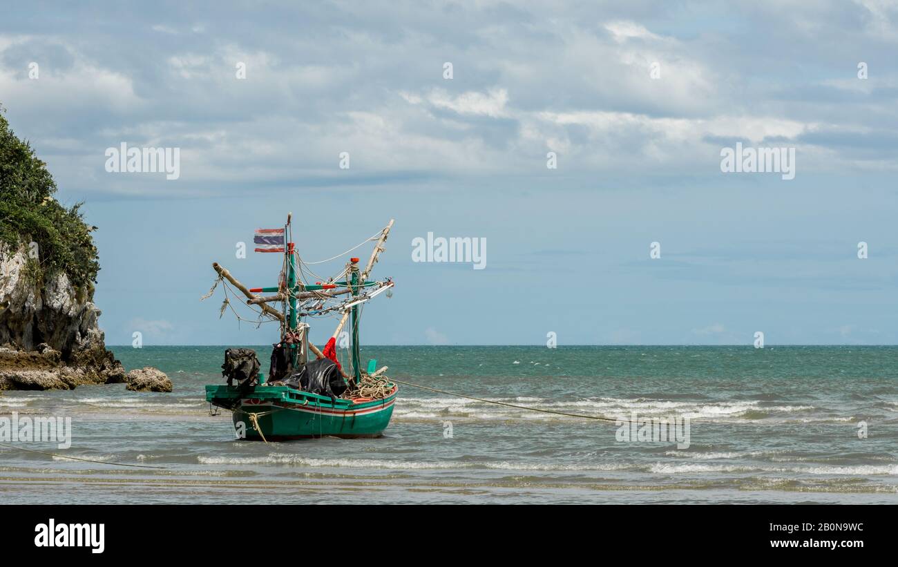Traditional Thai ishing boats at the beach in Pak Nam Pram, Thailand ...