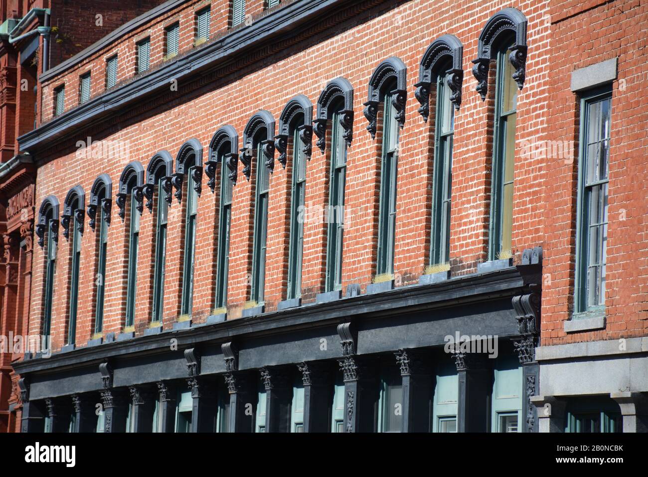 Historic old brick building with arches forming pattern Stock Photo - Alamy