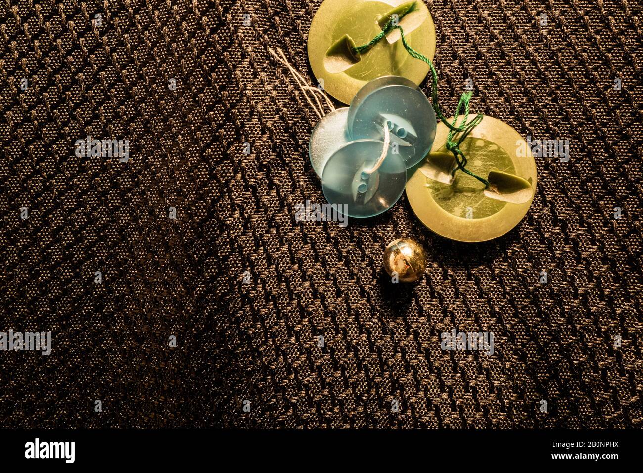 abstract sewing buttons and beads on black background Stock Photo - Alamy