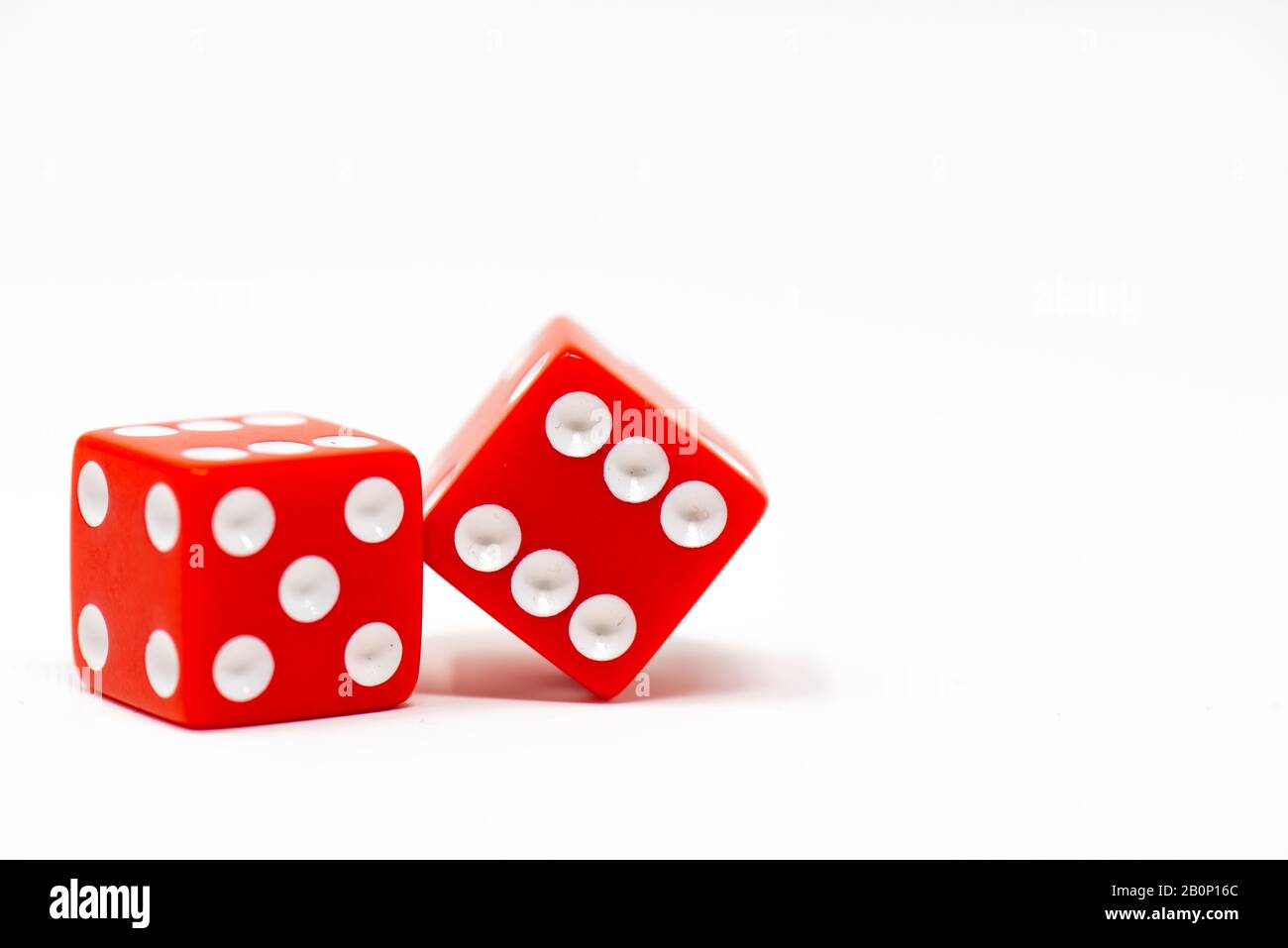 Pair of red dice isolated on white background Stock Photo - Alamy