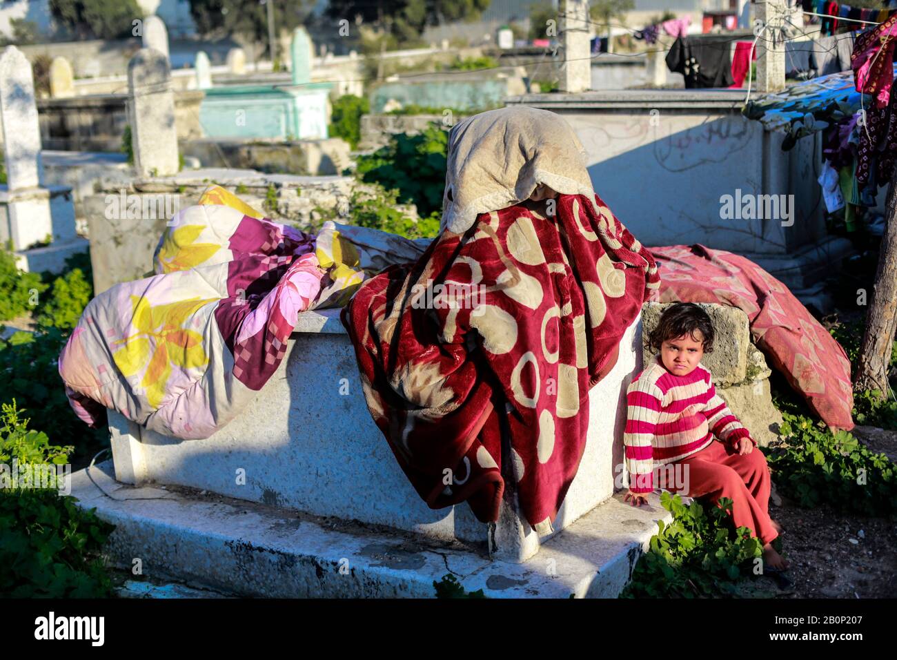 Gaza City, Palestine. 20th Feb, 2020. A Palestinian girl sits on a ...