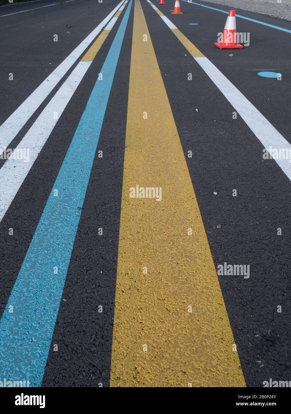 Various lines painted on asphalt. Yellow, blue, white. Part of a ...