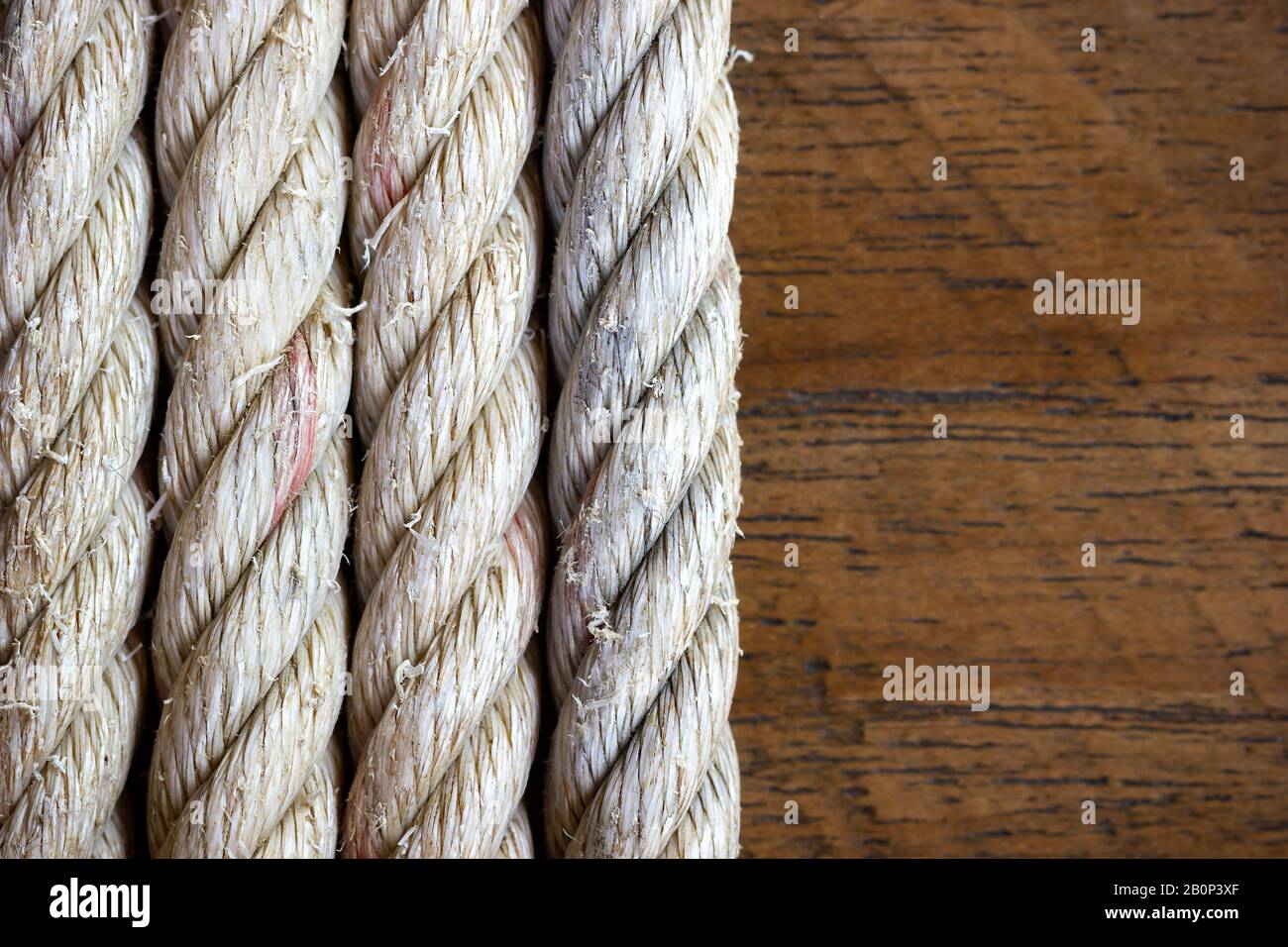 Rope vintage on brown wood background. Closeup and copy space Stock ...