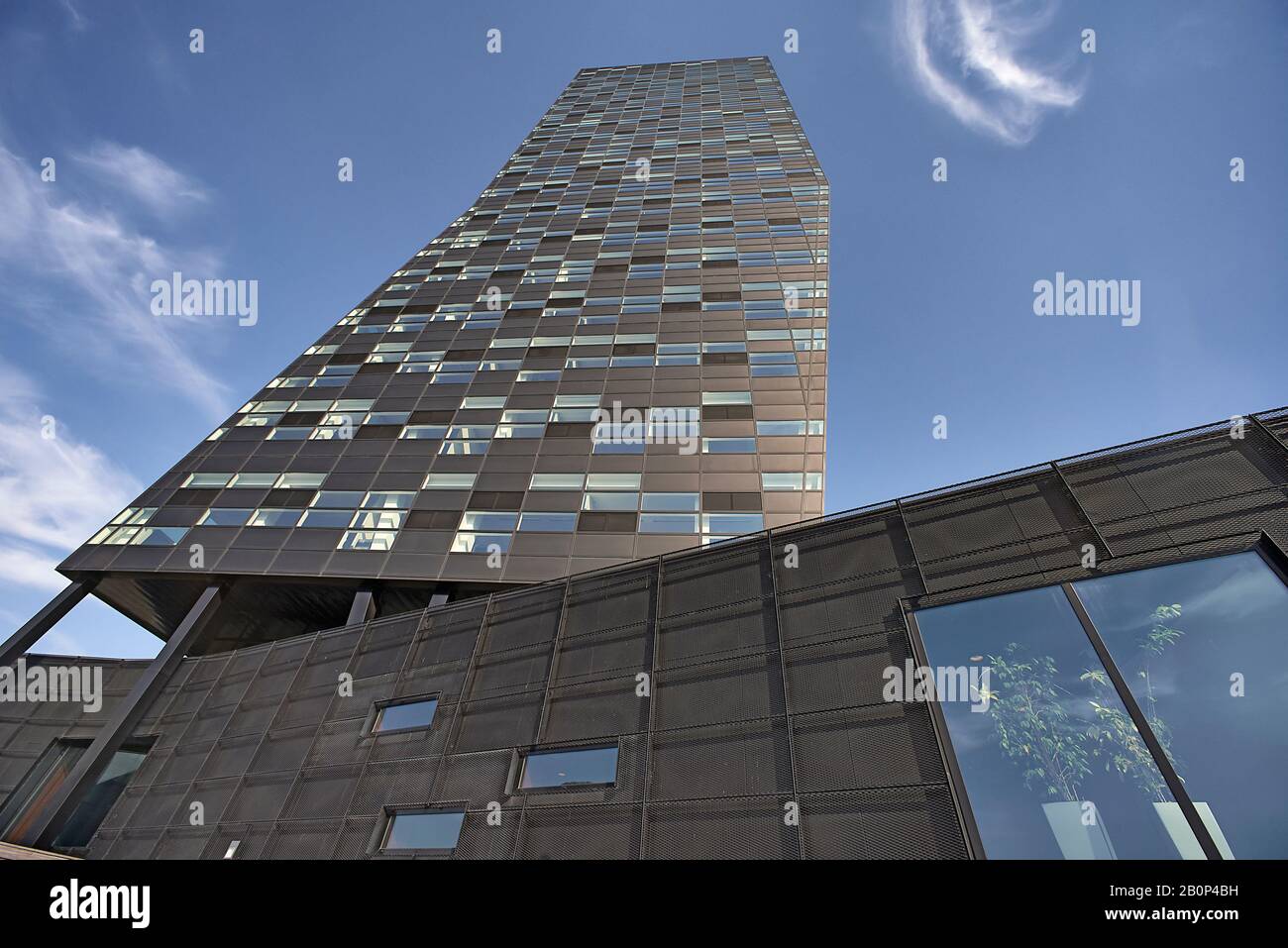 Modern futuristic exterior of a high rise office building in bright ...