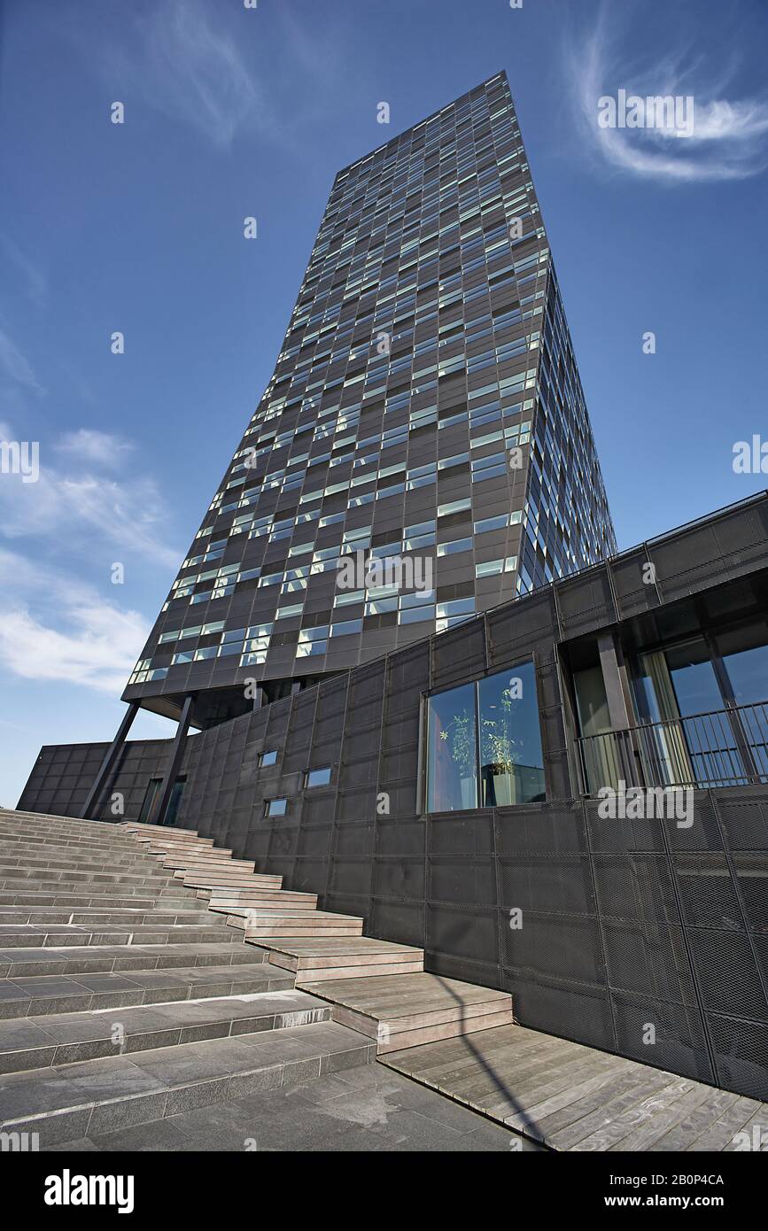 Modern futuristic exterior of a high rise office building in bright ...