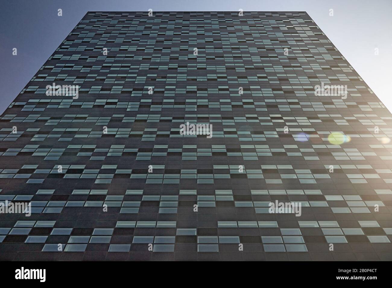Modern futuristic exterior of a high rise office building in bright ...