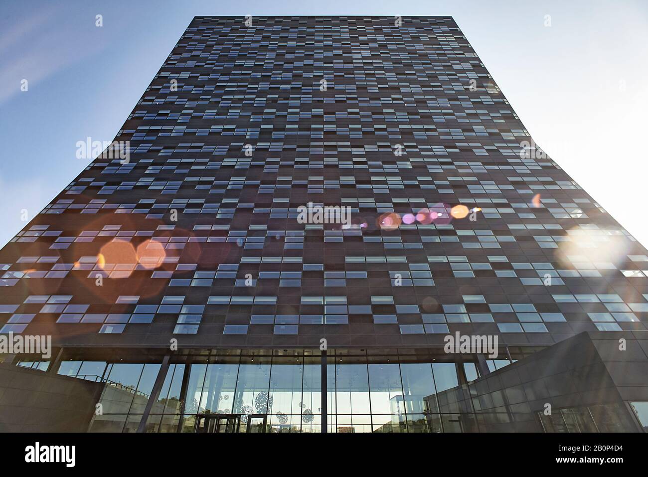 Modern futuristic exterior of a high rise office building in bright ...