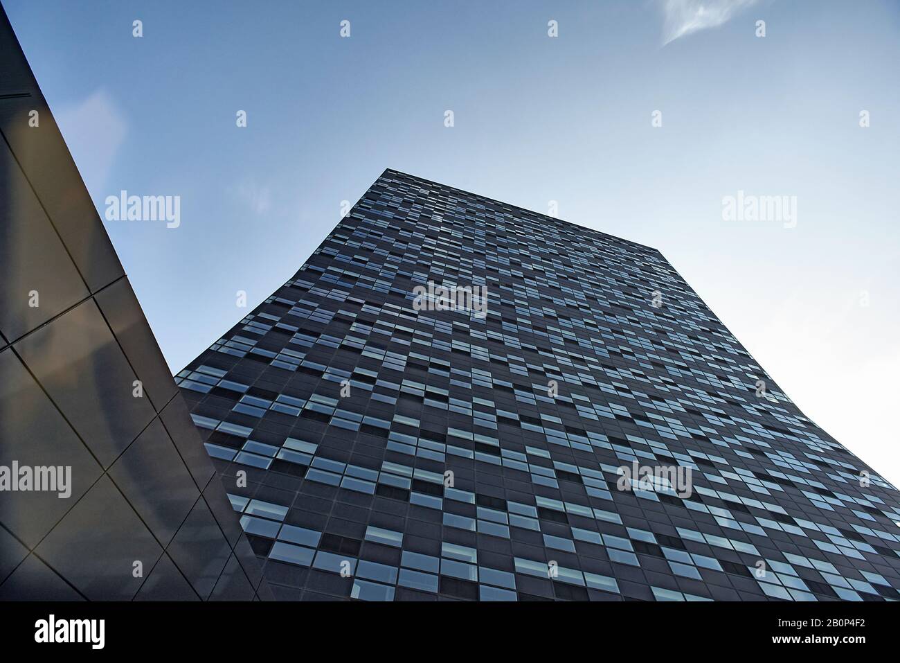Modern futuristic exterior of a high rise office building in bright ...