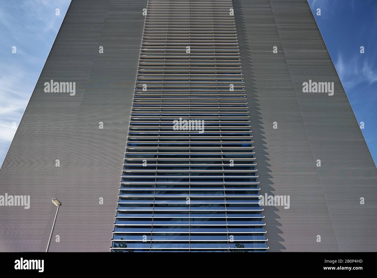 Modern futuristic exterior of a high rise office building in bright ...