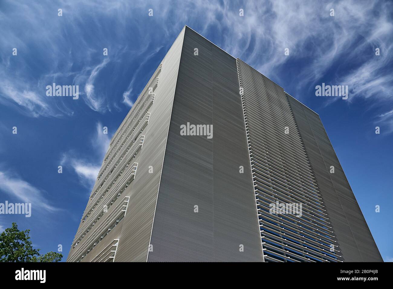 Modern futuristic exterior of a high rise office building in bright ...