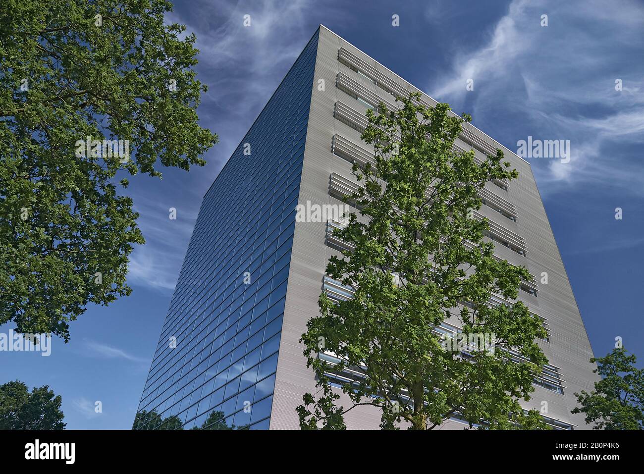 Modern futuristic exterior of a high rise office building in bright ...