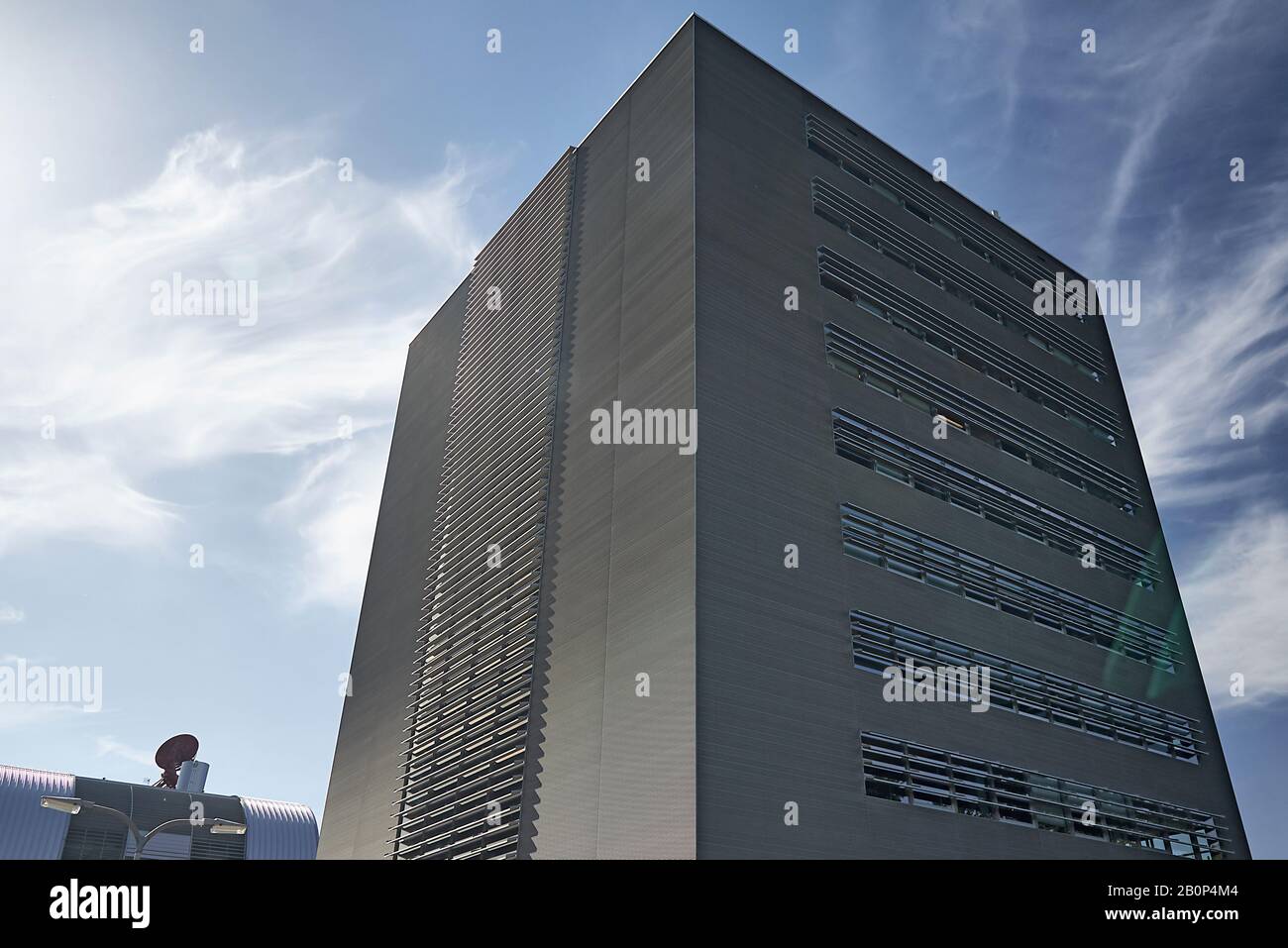 Modern futuristic exterior of a high rise office building in bright ...
