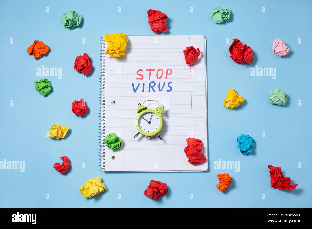 Stop virus text written on open notebook and alarm clock Stock Photo ...