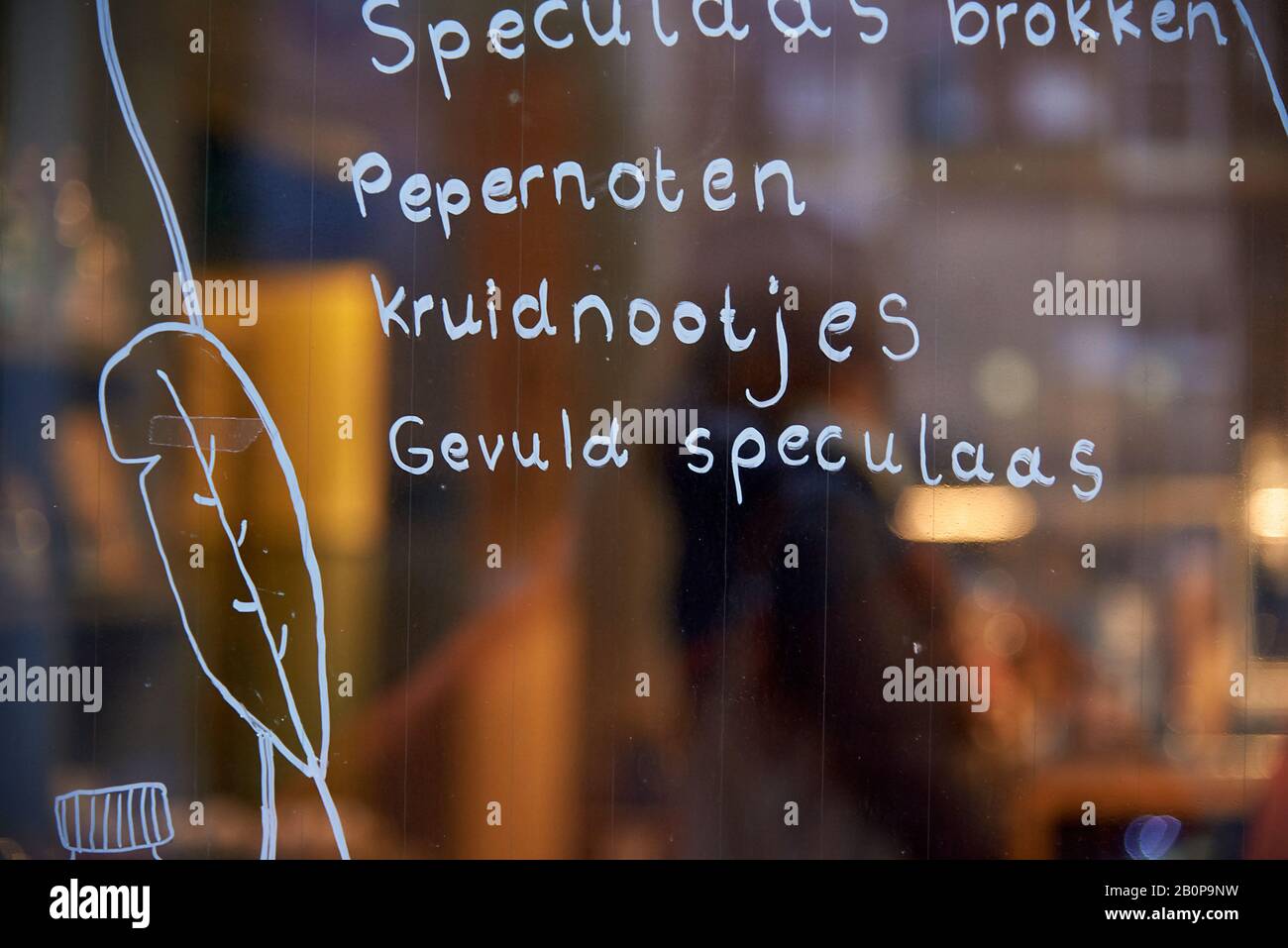 Close up of drawings and sign displayed on the window of a Dutch bakery ...