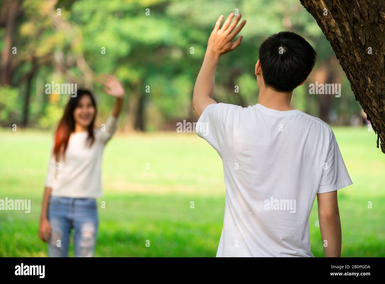 People Waving Goodbye To Each Other