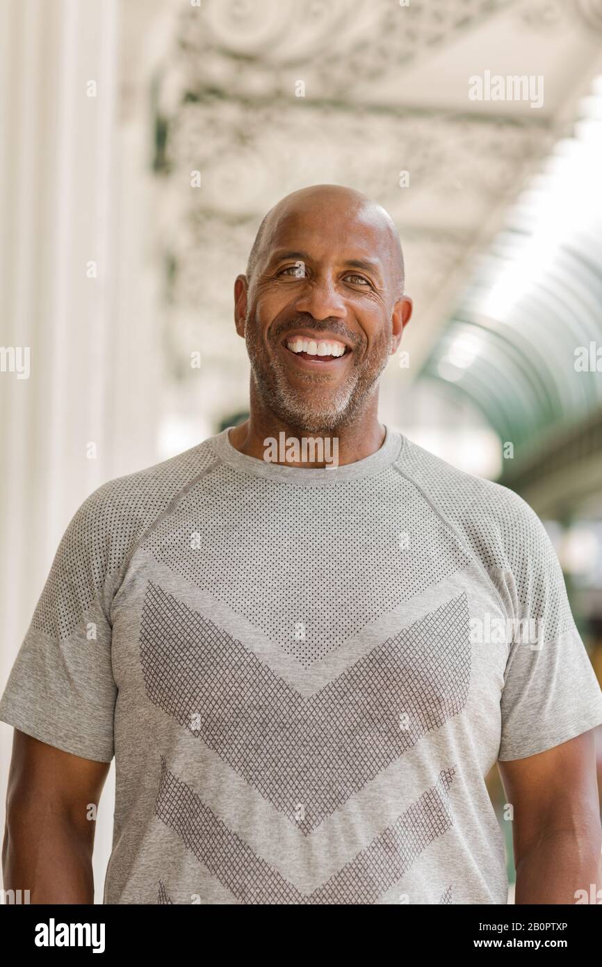 Happy mature African American man smiling outside Stock Photo - Alamy