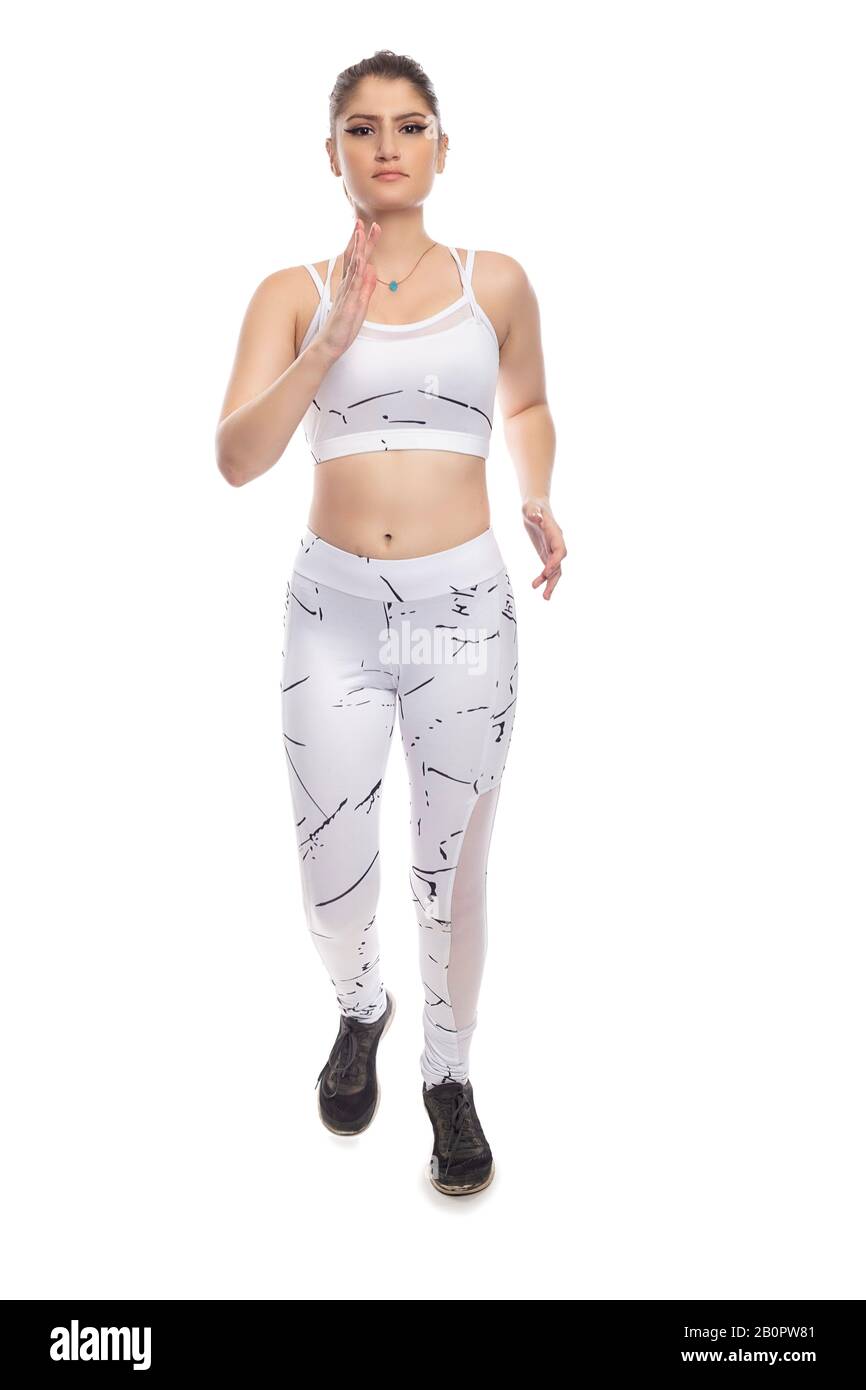 Woman wearing sports clothing running and isolated on white background ...