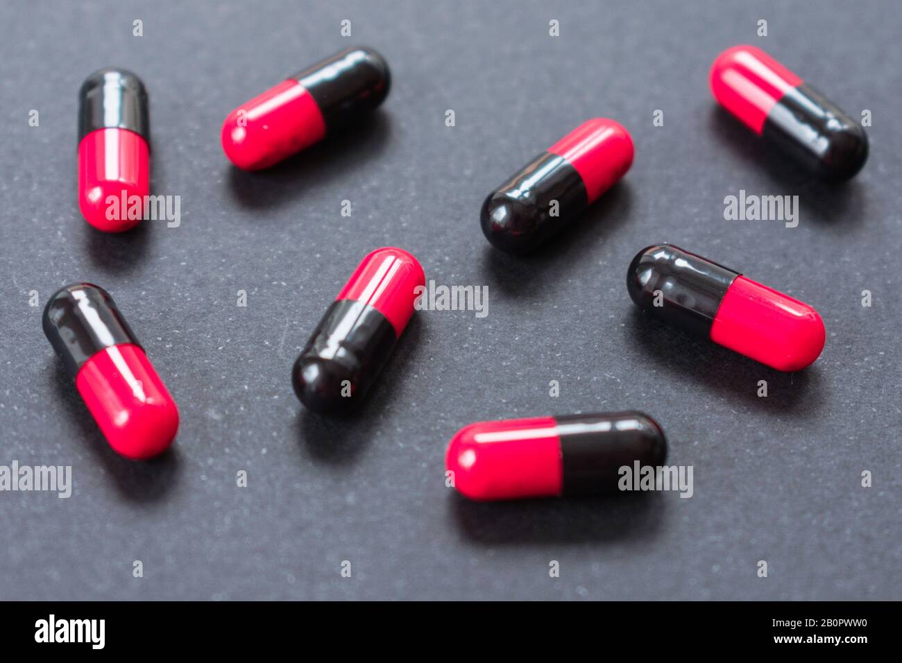 Black and red capsules hi-res stock photography and images - Alamy