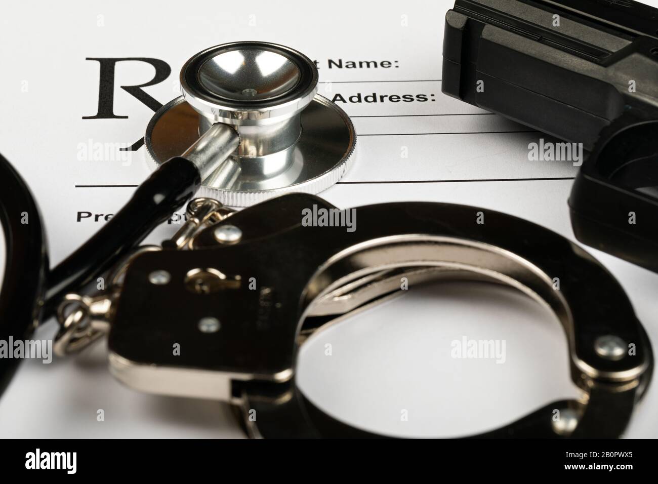 Picture of a medical prescription, handgun and handcuffs Stock Photo ...