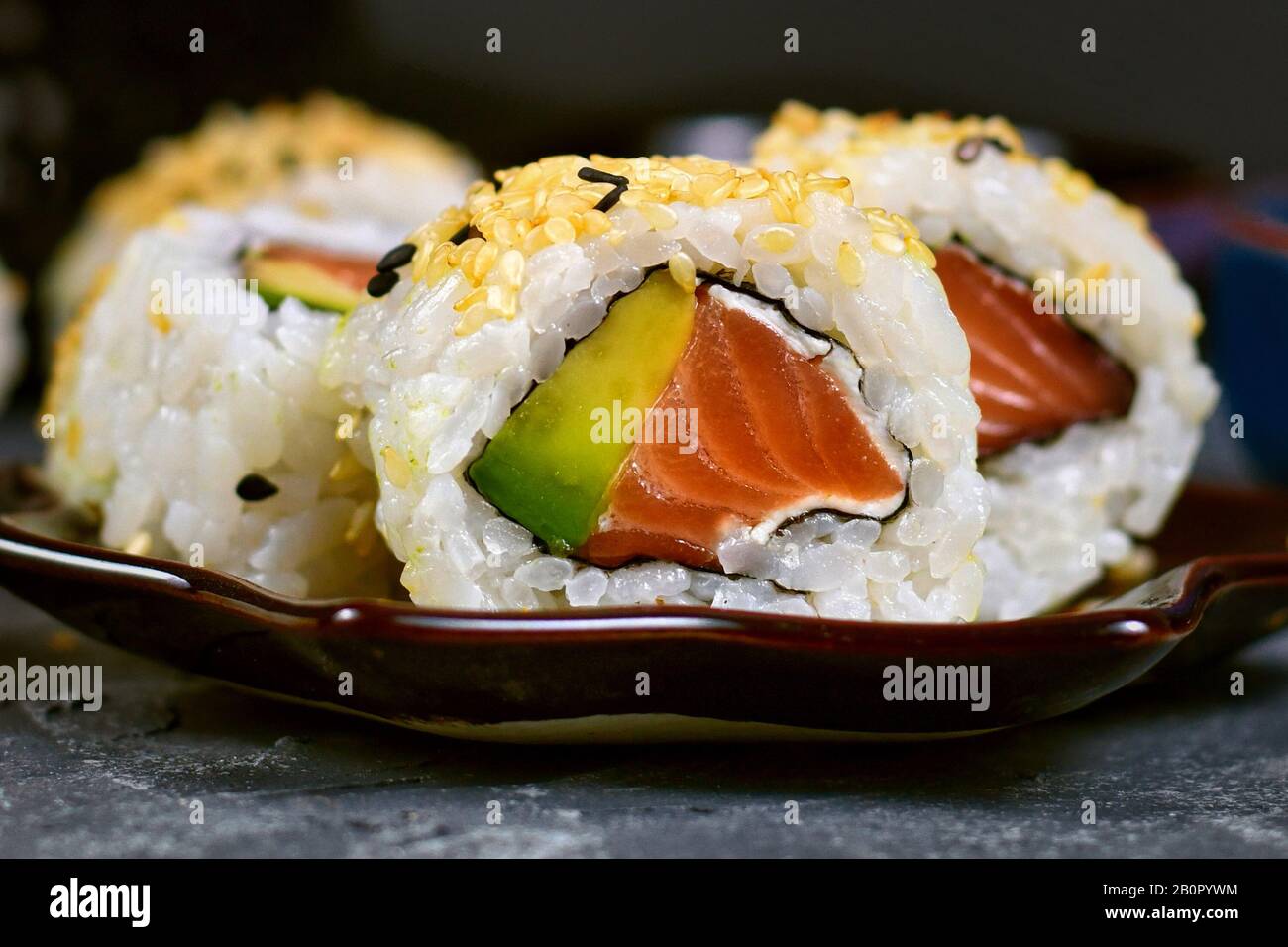 Inside out sushi california roll filed raw salmon fish, avocado, cream ...