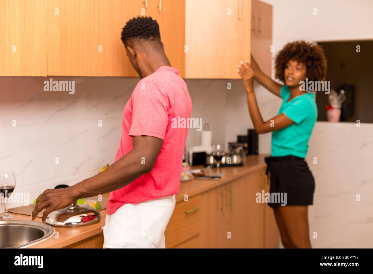 Black African American couple preparing food in the kitchen Stock Photo ...
