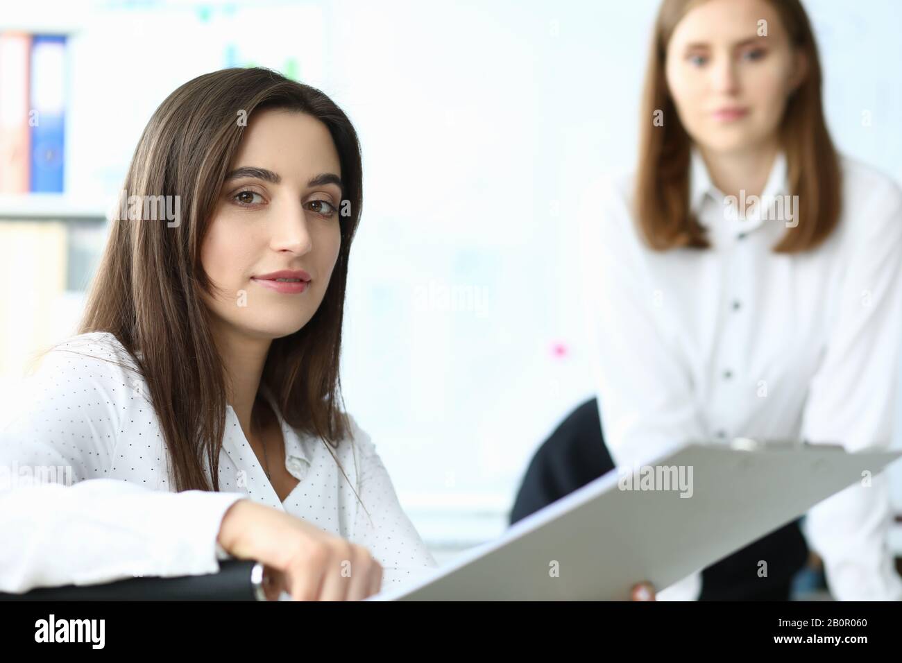 Pretty woman at workplace Stock Photo - Alamy