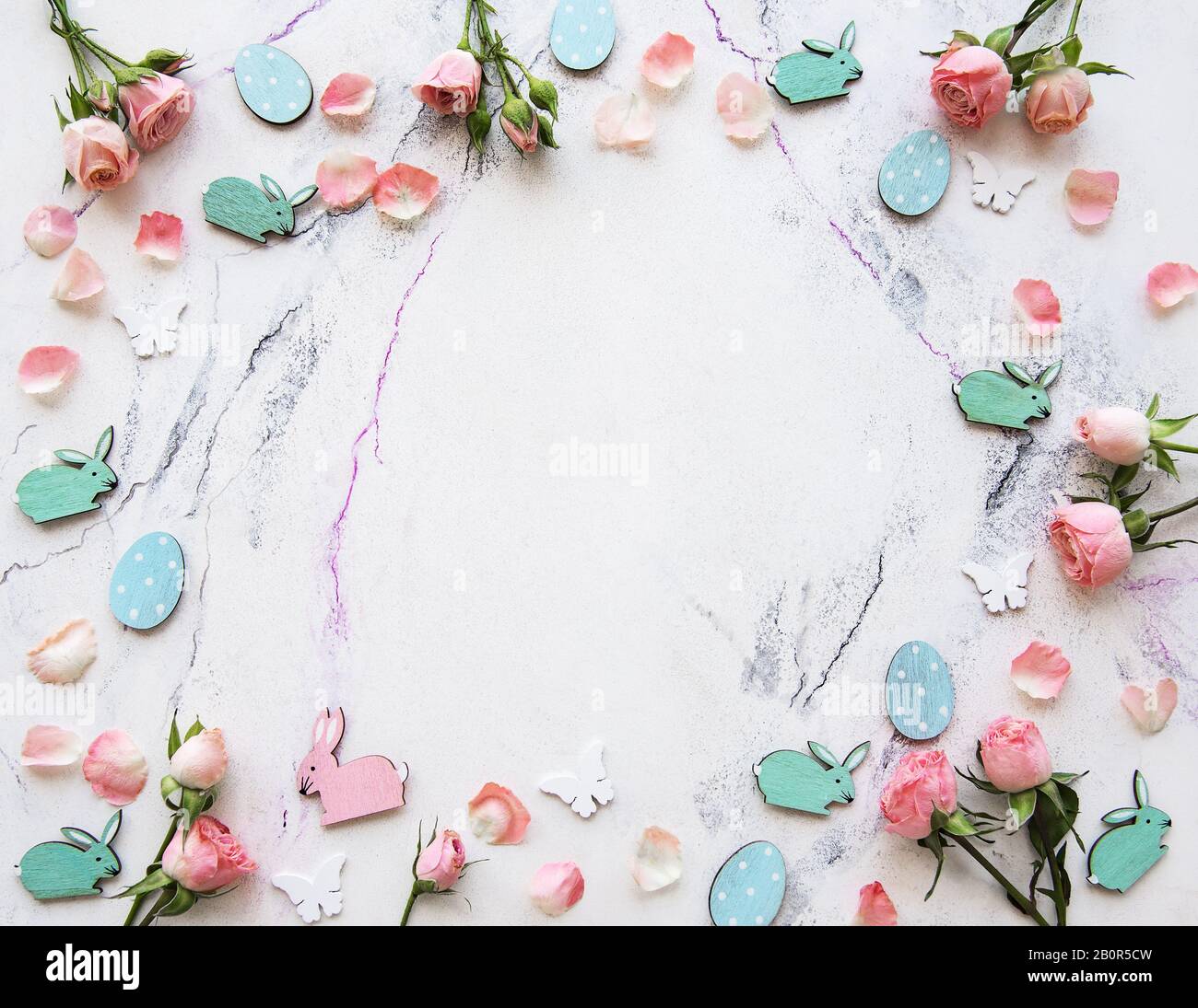 Spring holiday theme, pink roses and decorations on a white marble ...