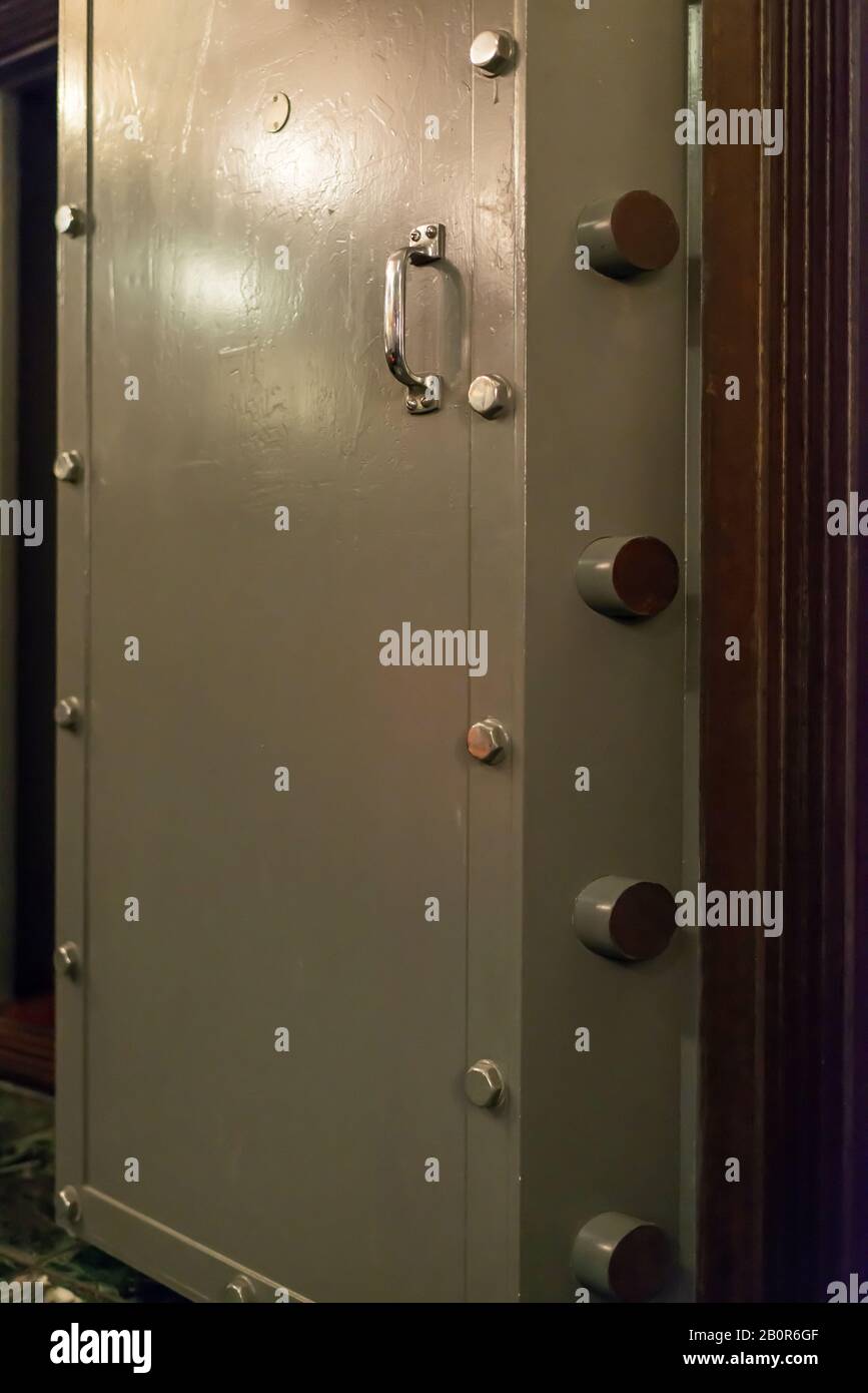 Opened old-fashioned solid vault door of a bank Stock Photo - Alamy