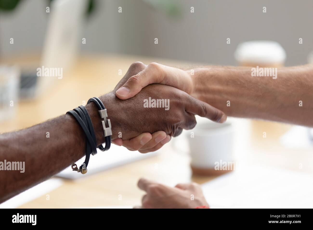 Close up African American businessman shaking hand of business partner ...
