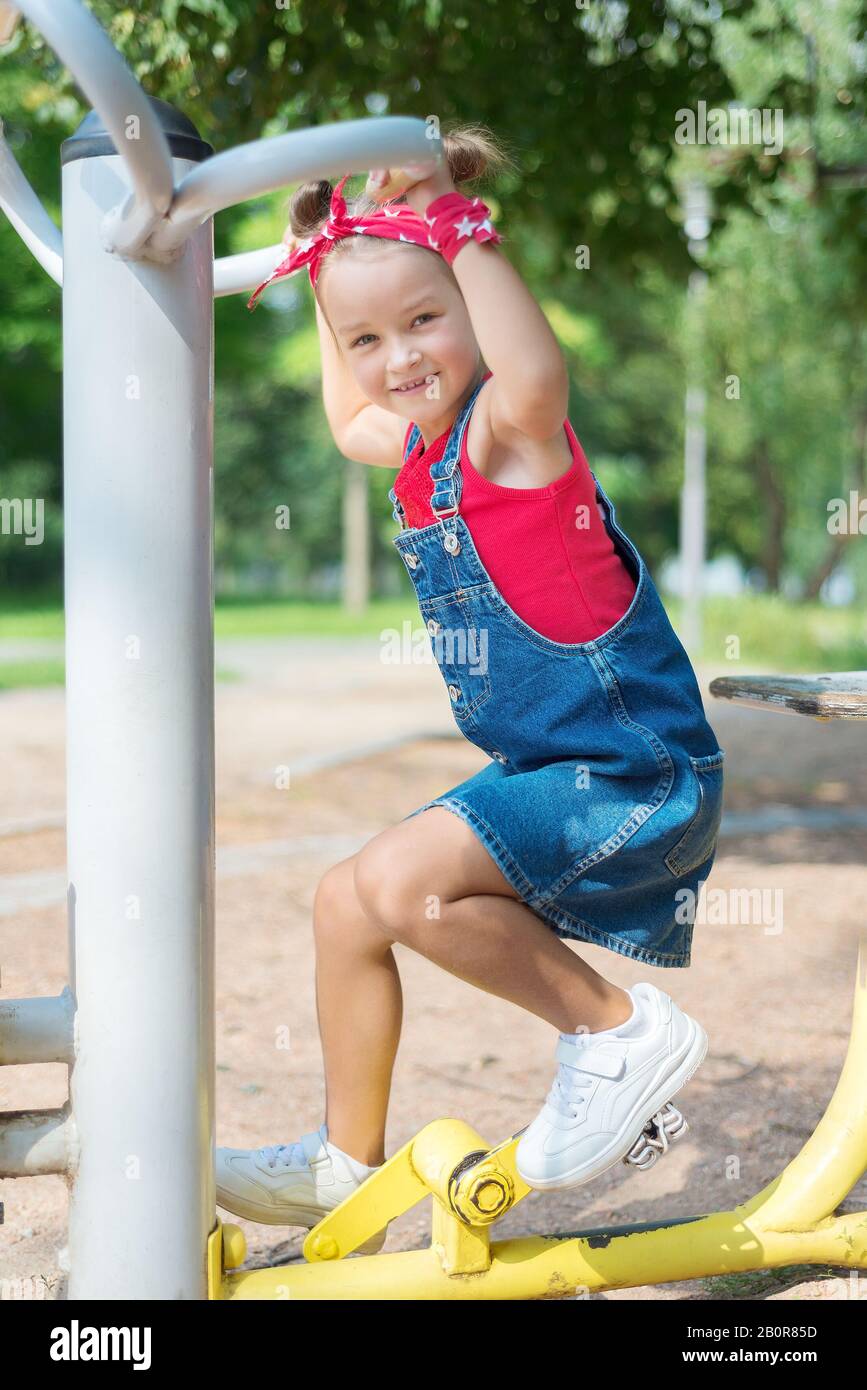 happy child in the playground kid. trains on a stepper trainer Stock ...