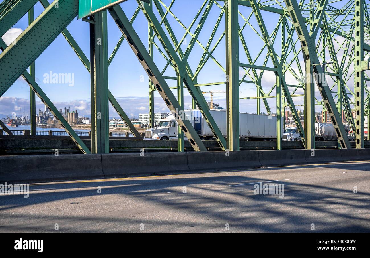 Convoy of different big rigs industrial long haul white diesel semi ...