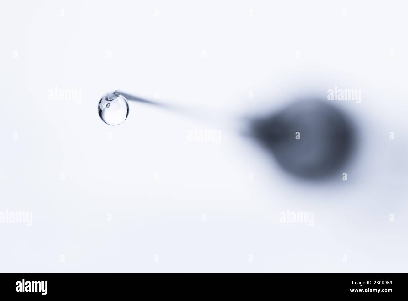 Drop on a medical needle. Macro photo of an injection or vaccination ...