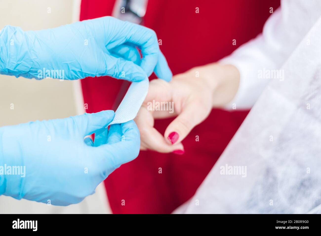 Finger plaster blue hi-res stock photography and images - Alamy