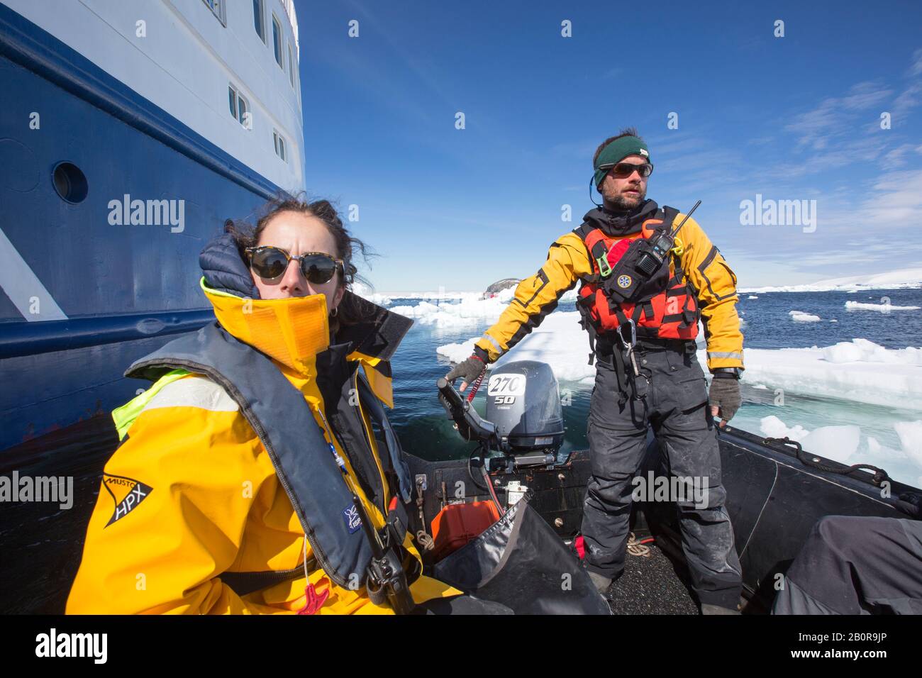 Polar guides in a zodiac next to an expedition cruise ship off Eden ...