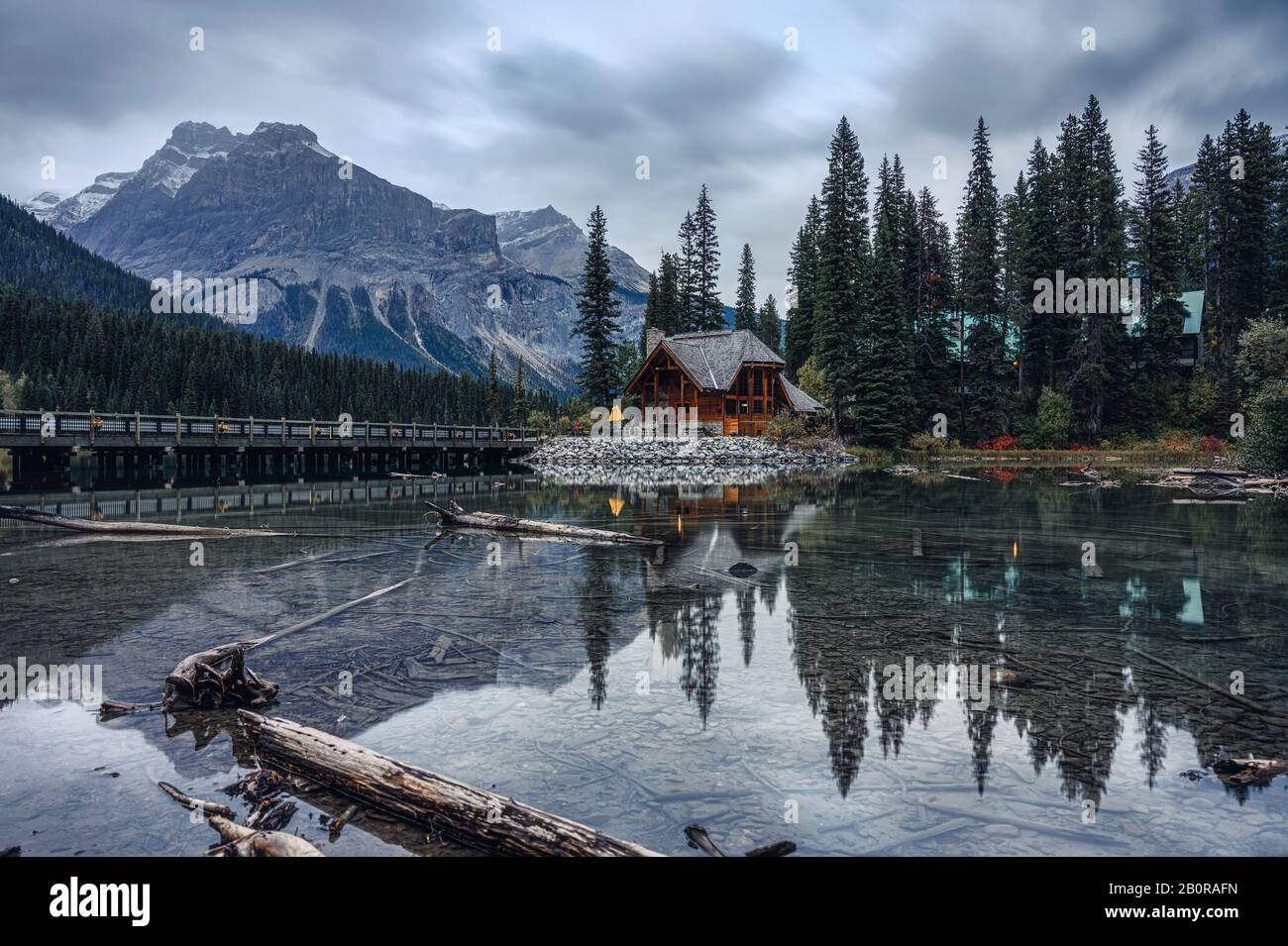 Wooden house with rocky mountain in pine forest at Emerald lake, Yoho ...