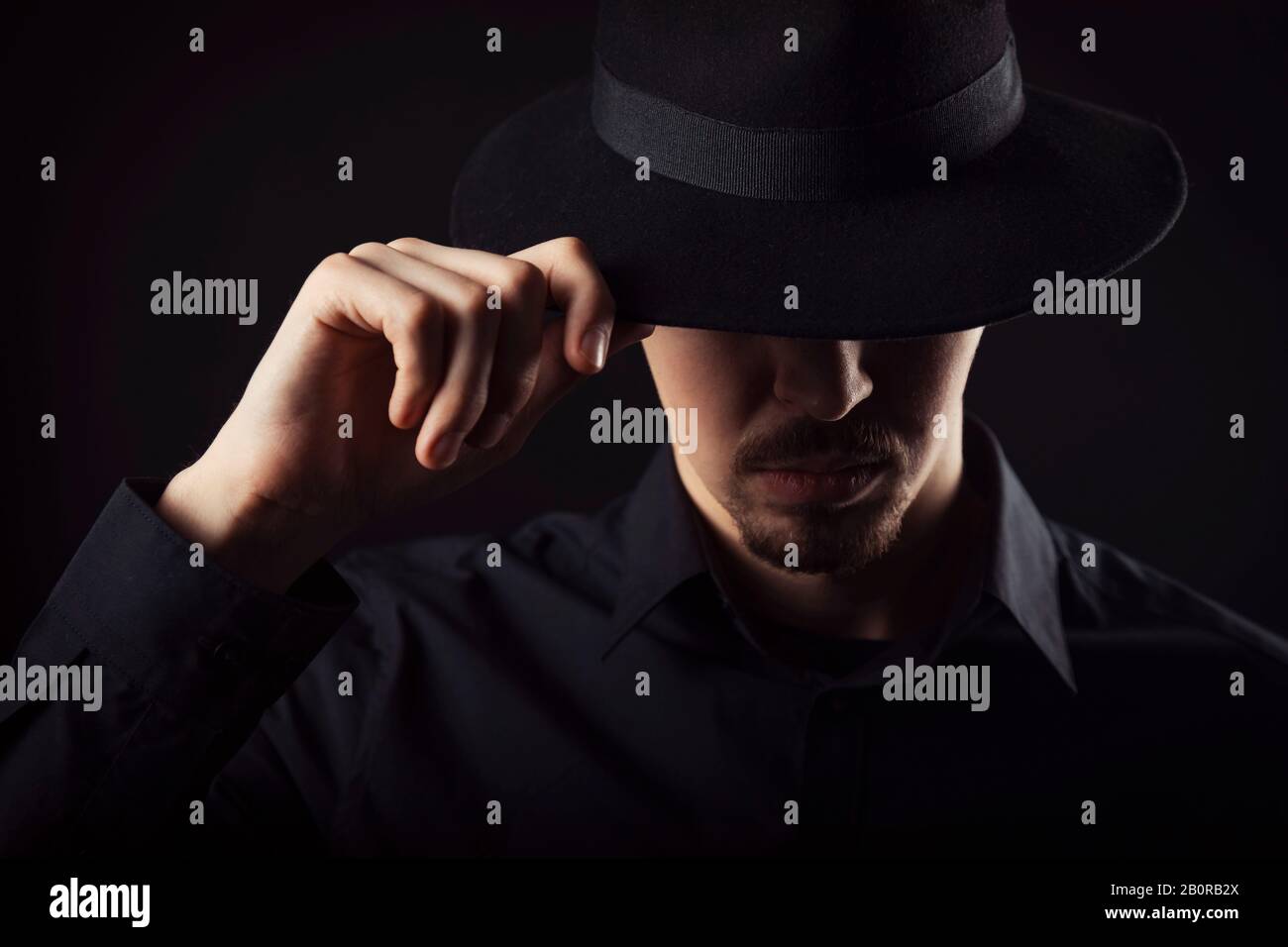 Male tipping hat close-up Stock Photo - Alamy
