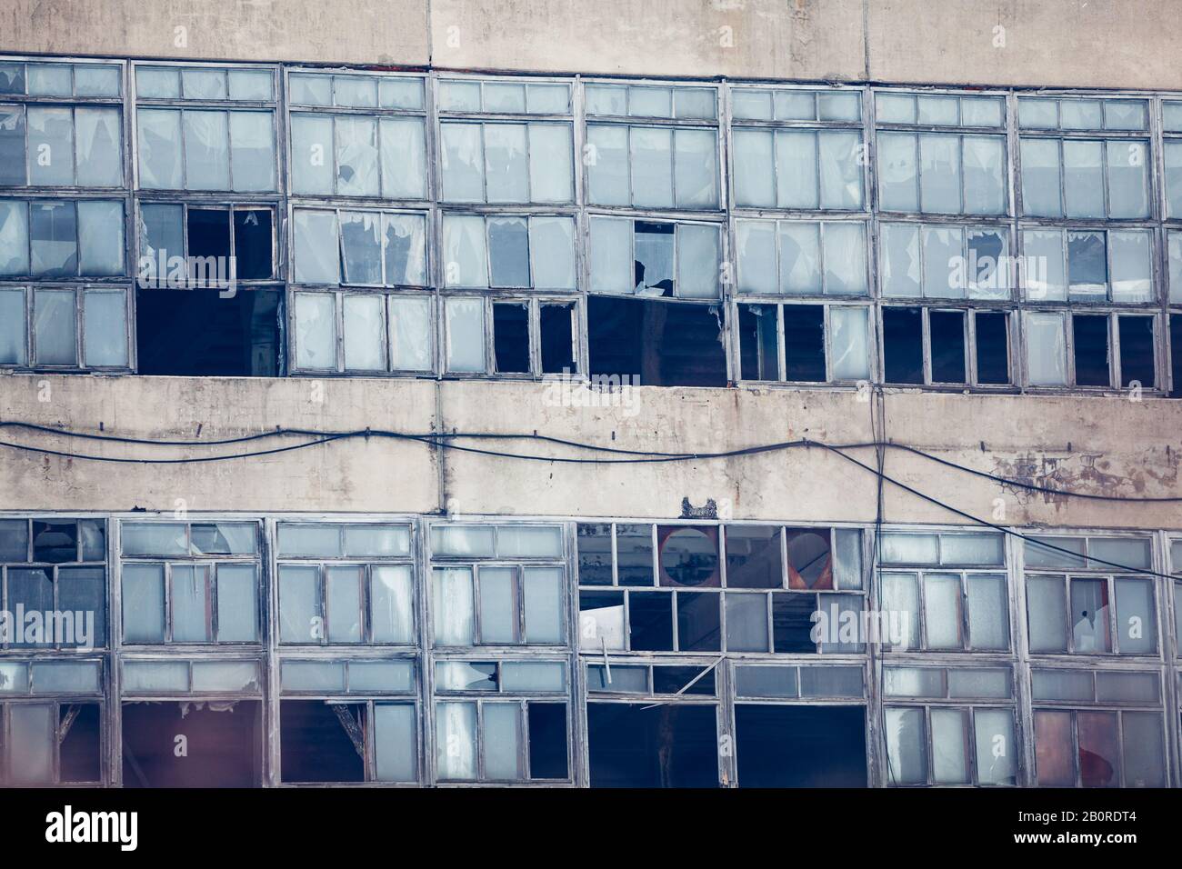 industry abounded house wall with broken glass windows Stock Photo - Alamy
