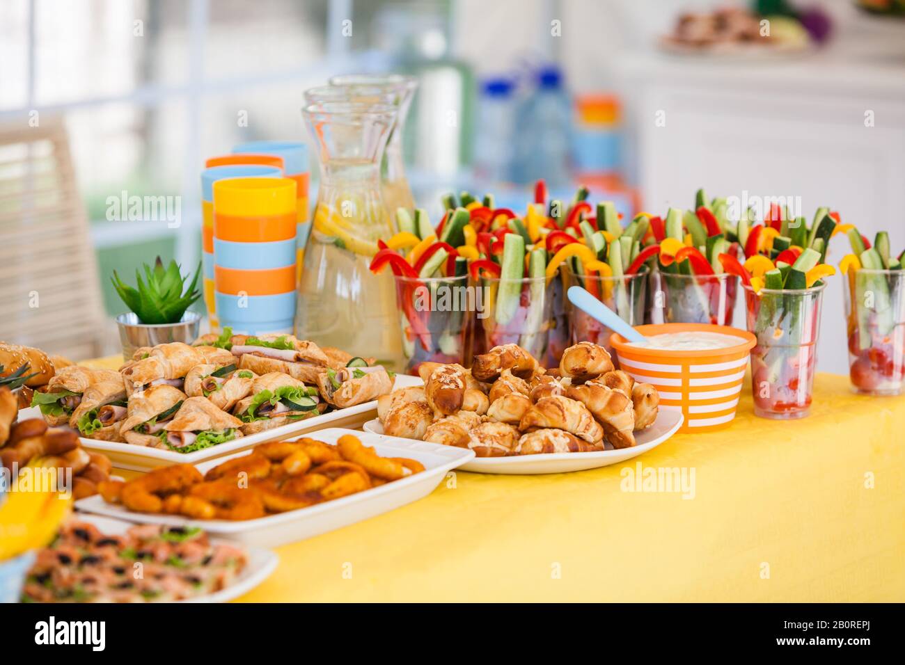 buffet for celebration birthday food on plates, home made sandwiches ...