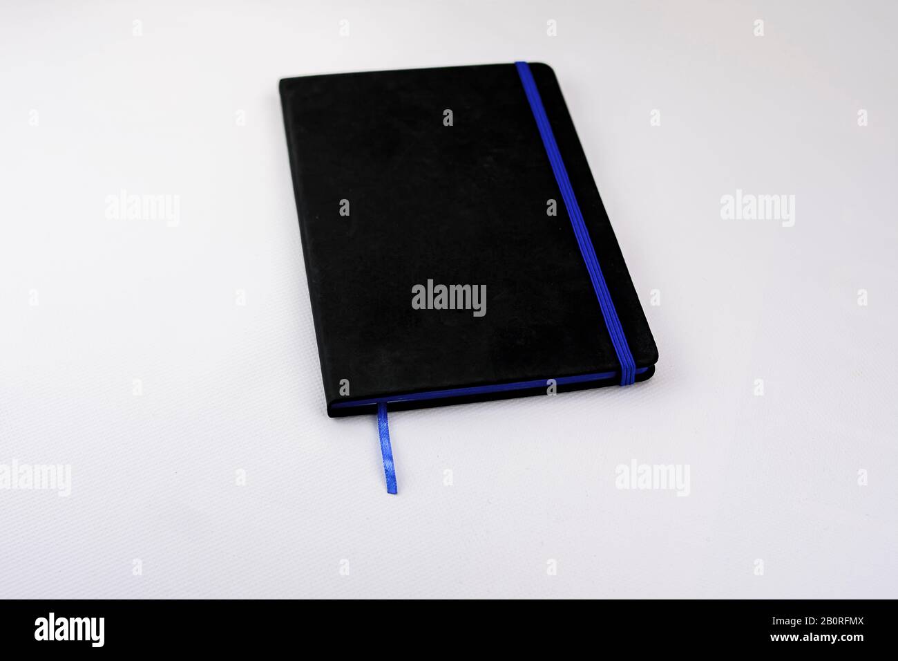 Closed black leather diary with blue trim and separator for mockup as a ...
