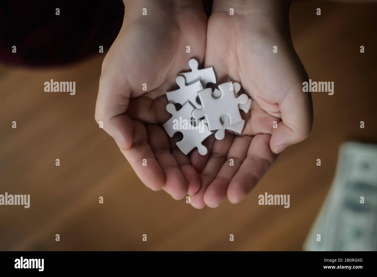 Hand holding jigsaw puzzles, Business partnership concept Stock Photo ...