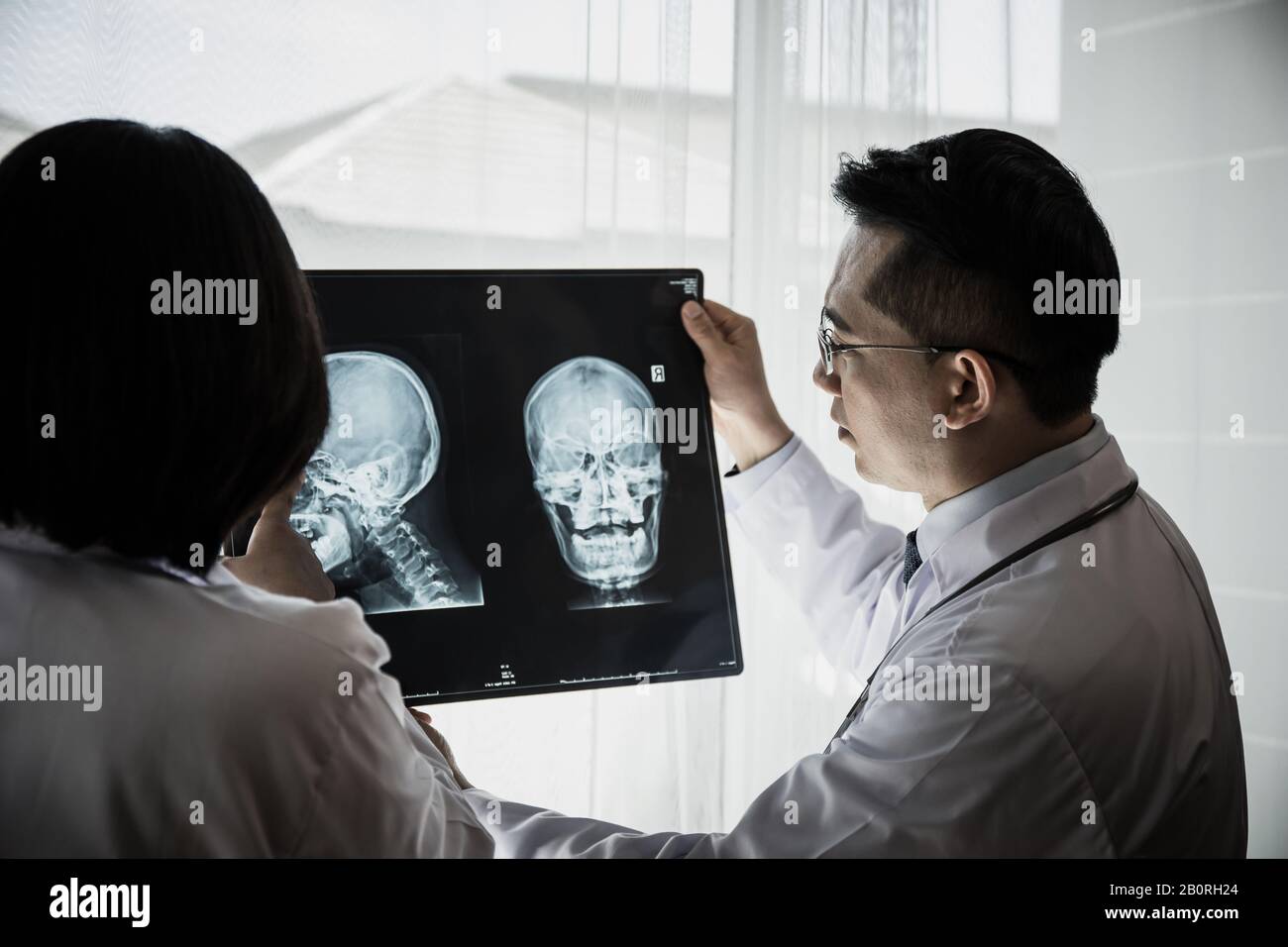 Close up of doctor holding x-ray, x-ray film of patient at hospital ...