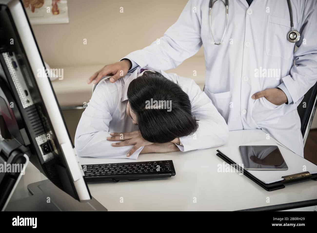 Exhausted doctor sleeping workplace hi-res stock photography and images ...