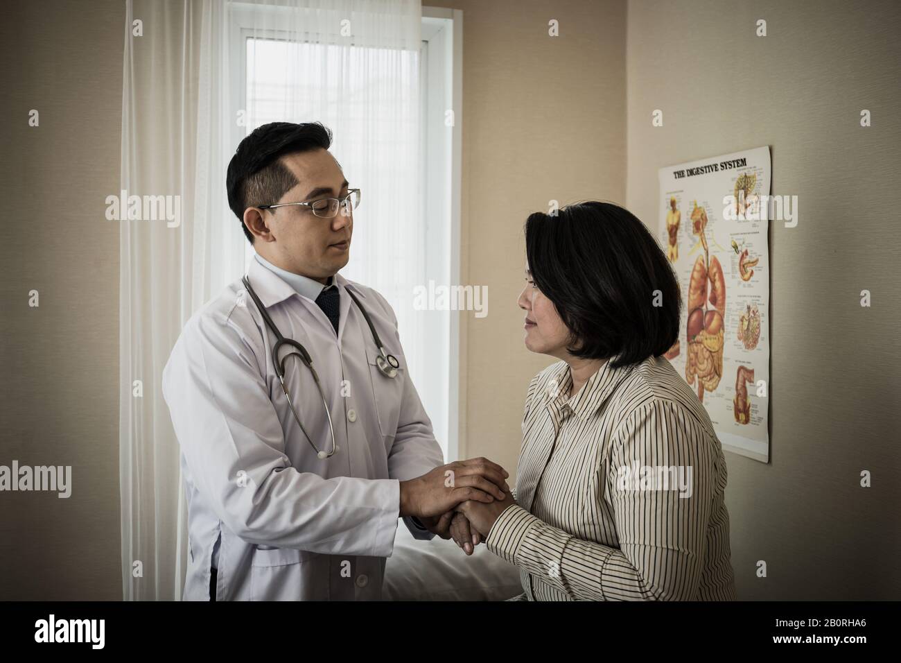 Doctor assisted the patient during his health check-up at the hospital ...