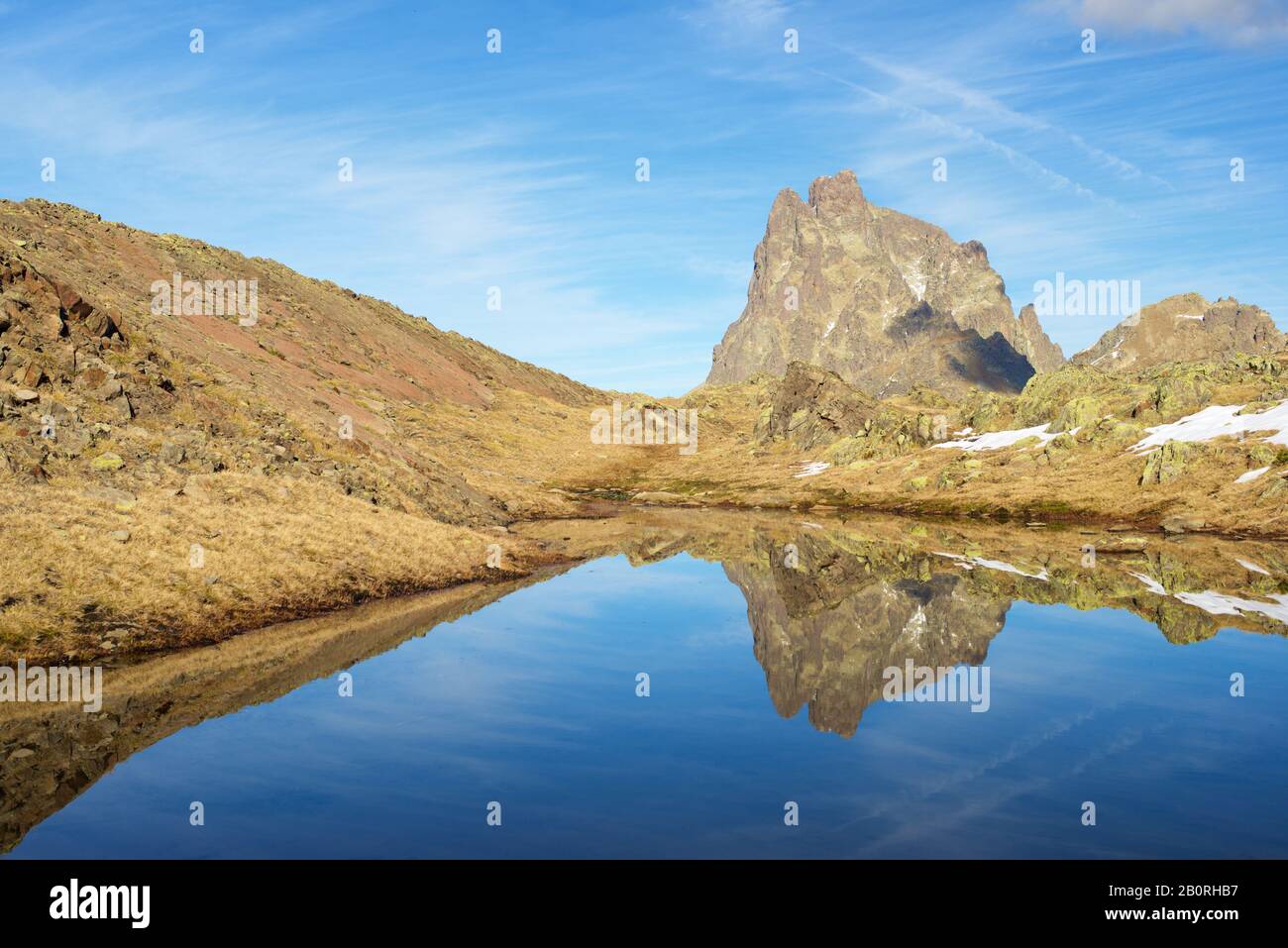 Midi Dossau Peak reflected in a lake. Ossau Valley, Pyrenees National ...