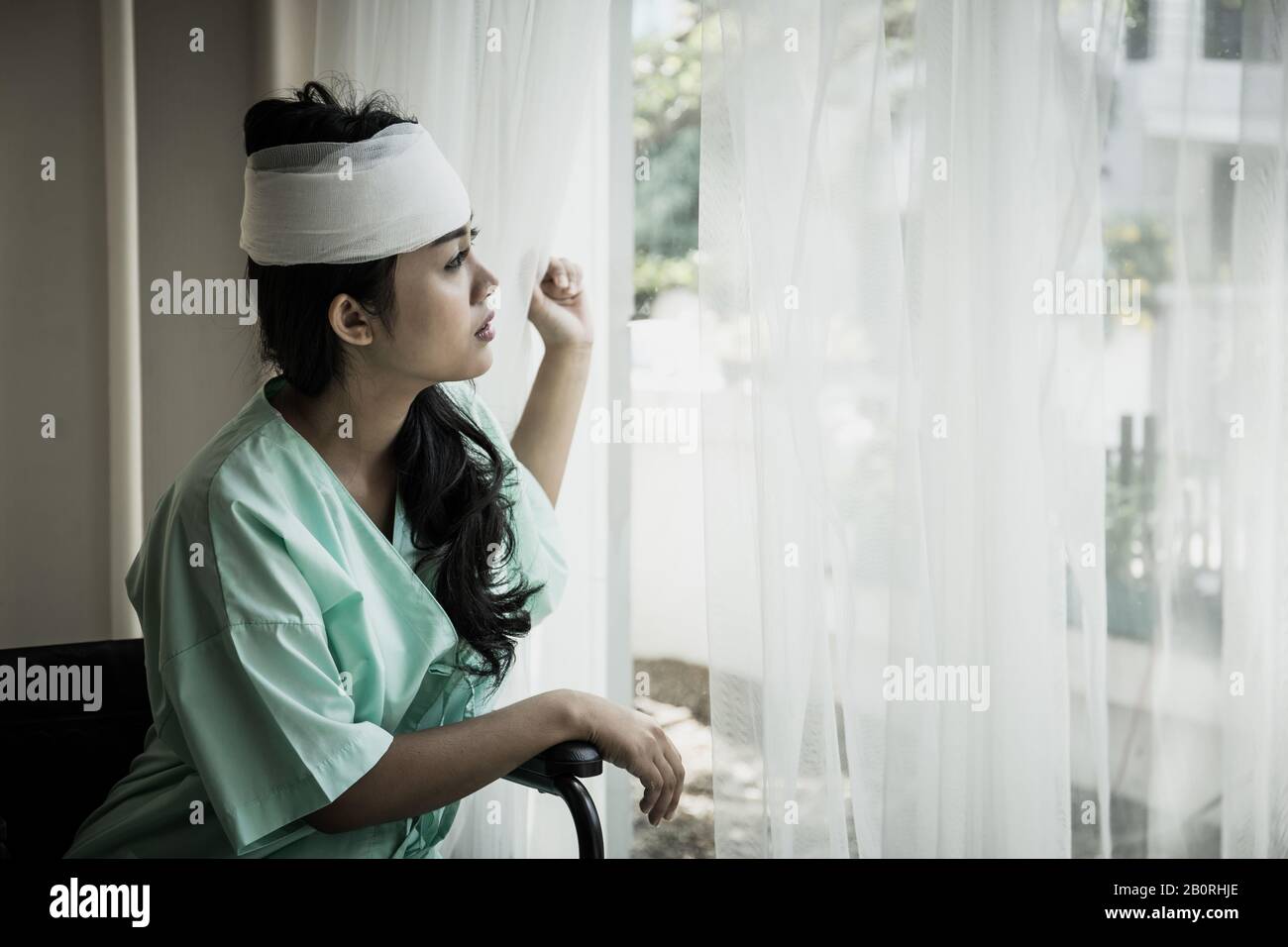 Female patients sitting on wheelchairs have pain after hospitalization ...