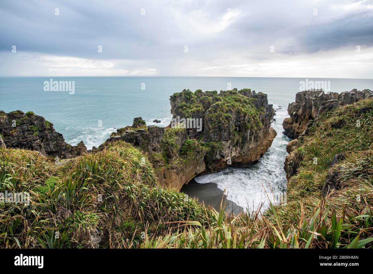 Bay with sandstone rocks, rock formation Pancake Rocks, Paparoa ...