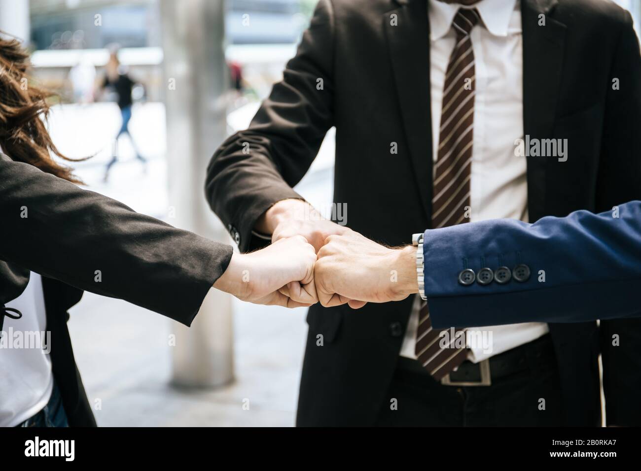 3 hands together team hi-res stock photography and images - Alamy