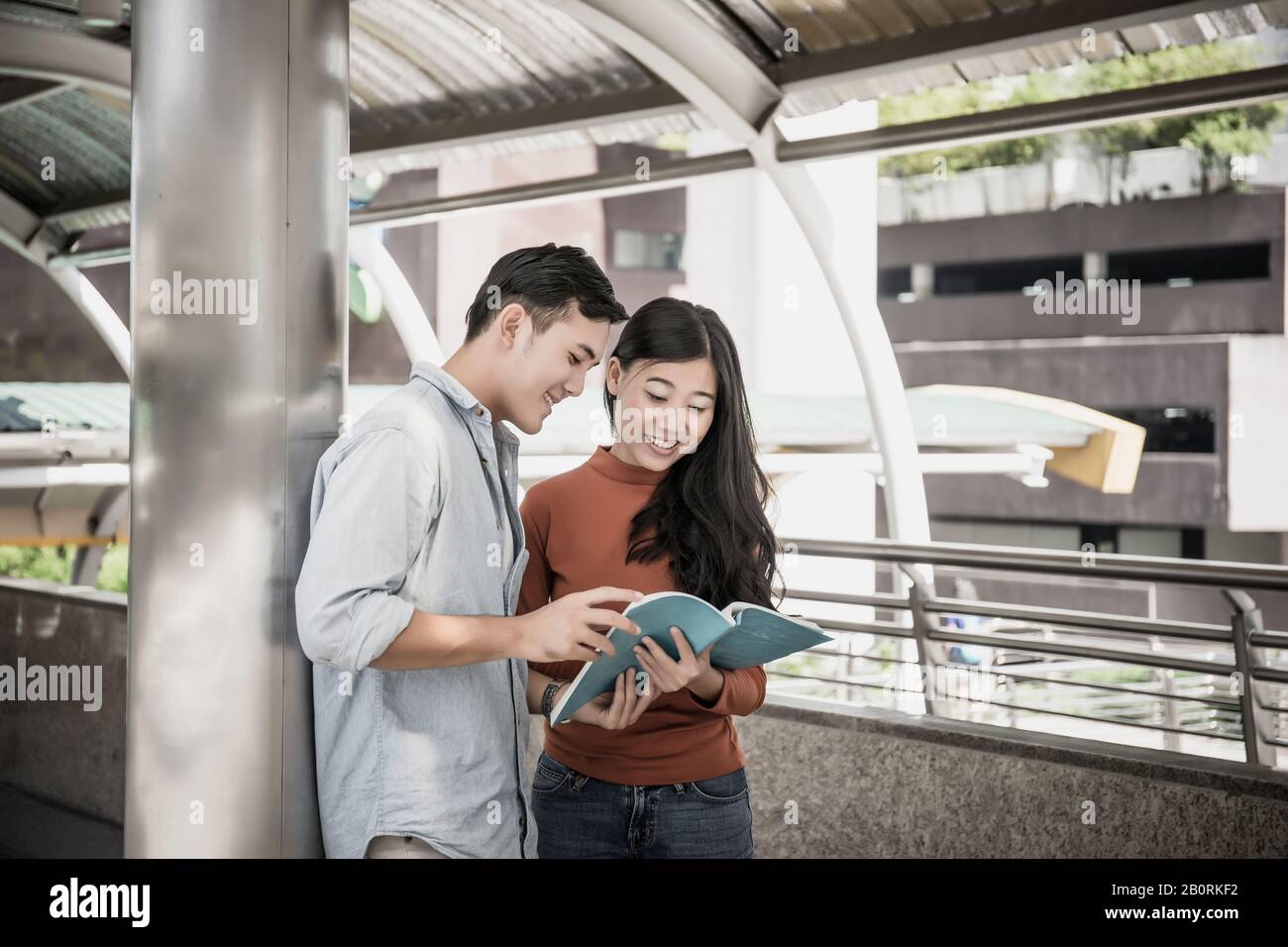 Couple standing on books hi-res stock photography and images - Alamy
