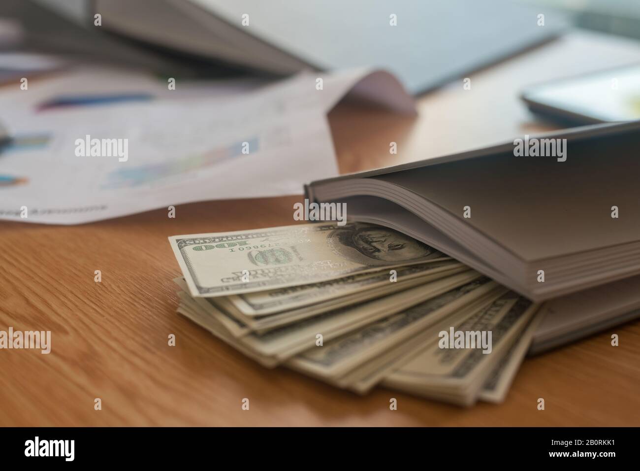 US Dollar bank note inside book on wood table. business financial ...